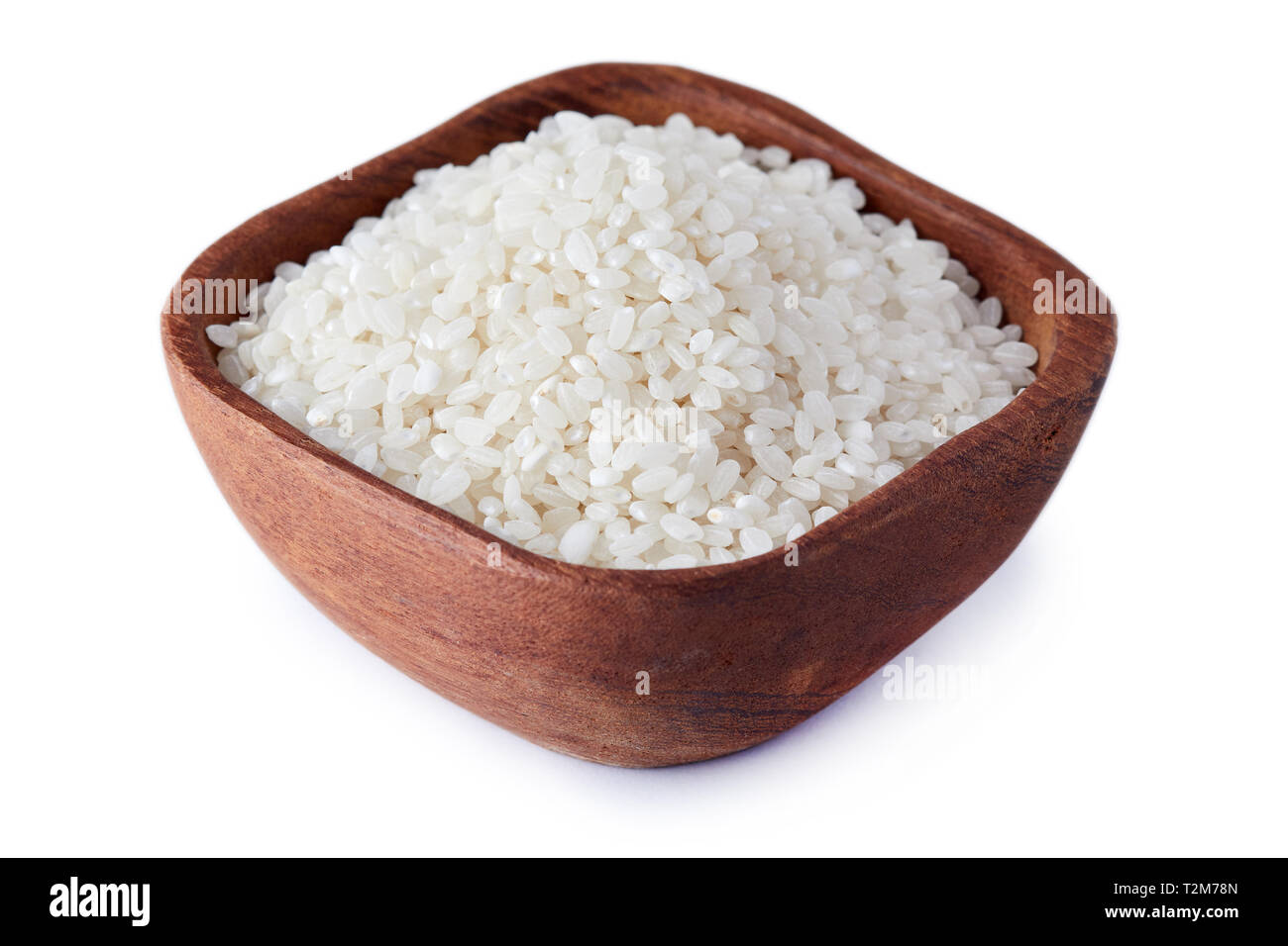 Raw uncooked sushi rice in wooden bowl isolated on white background ...