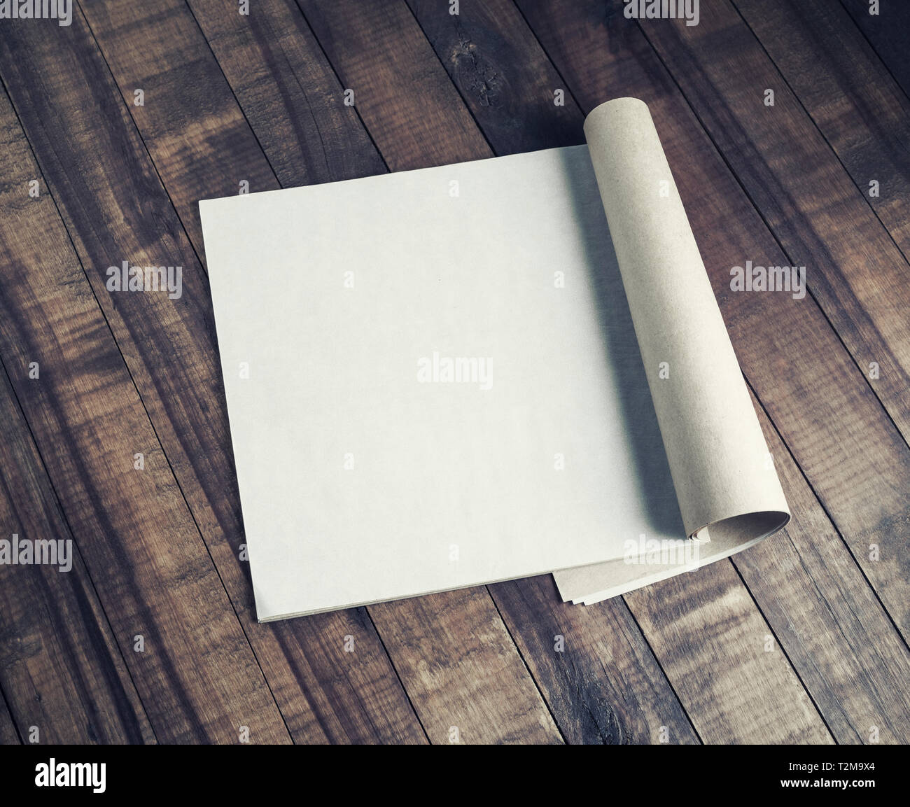 Blank open booklet on vintage wood table background. Responsive design ...