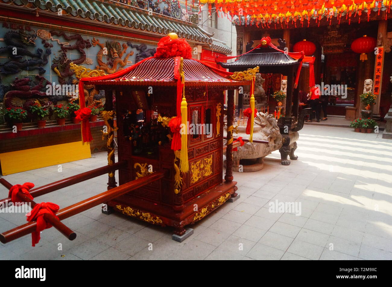 Shenzhen, China: people watch a traditional puppet show at the ...