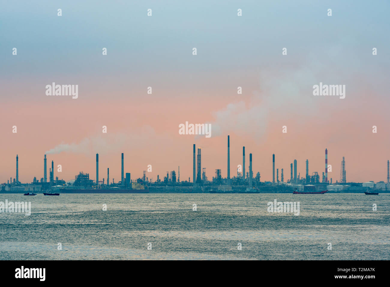 Oil refinery at sunset on Bukom Island in Singapore Stock Photo - Alamy