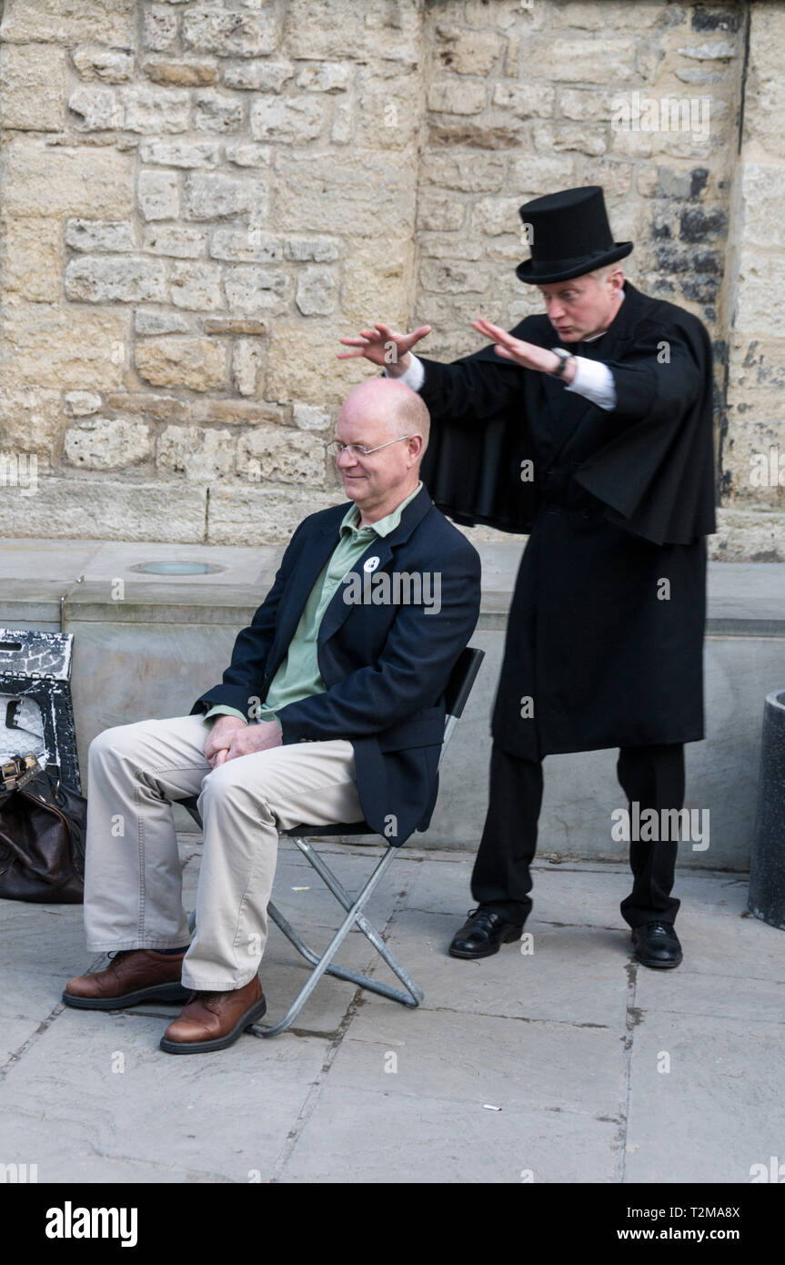 Bill Spectre wearing his traditional Victorian hat and cloak, giving ...