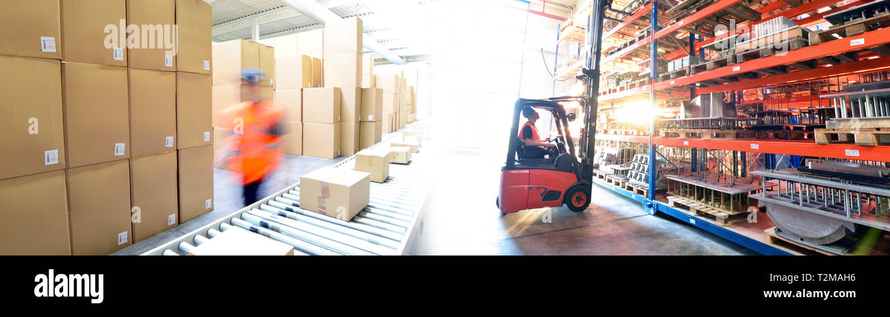 logistics and transport workers in a goods warehouse with goods for ...