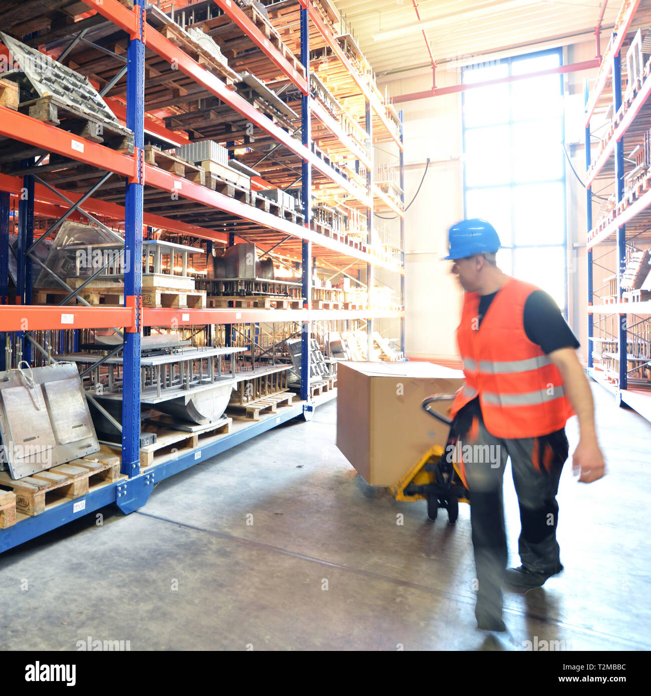 logistics and transport workers in a goods warehouse with goods for ...