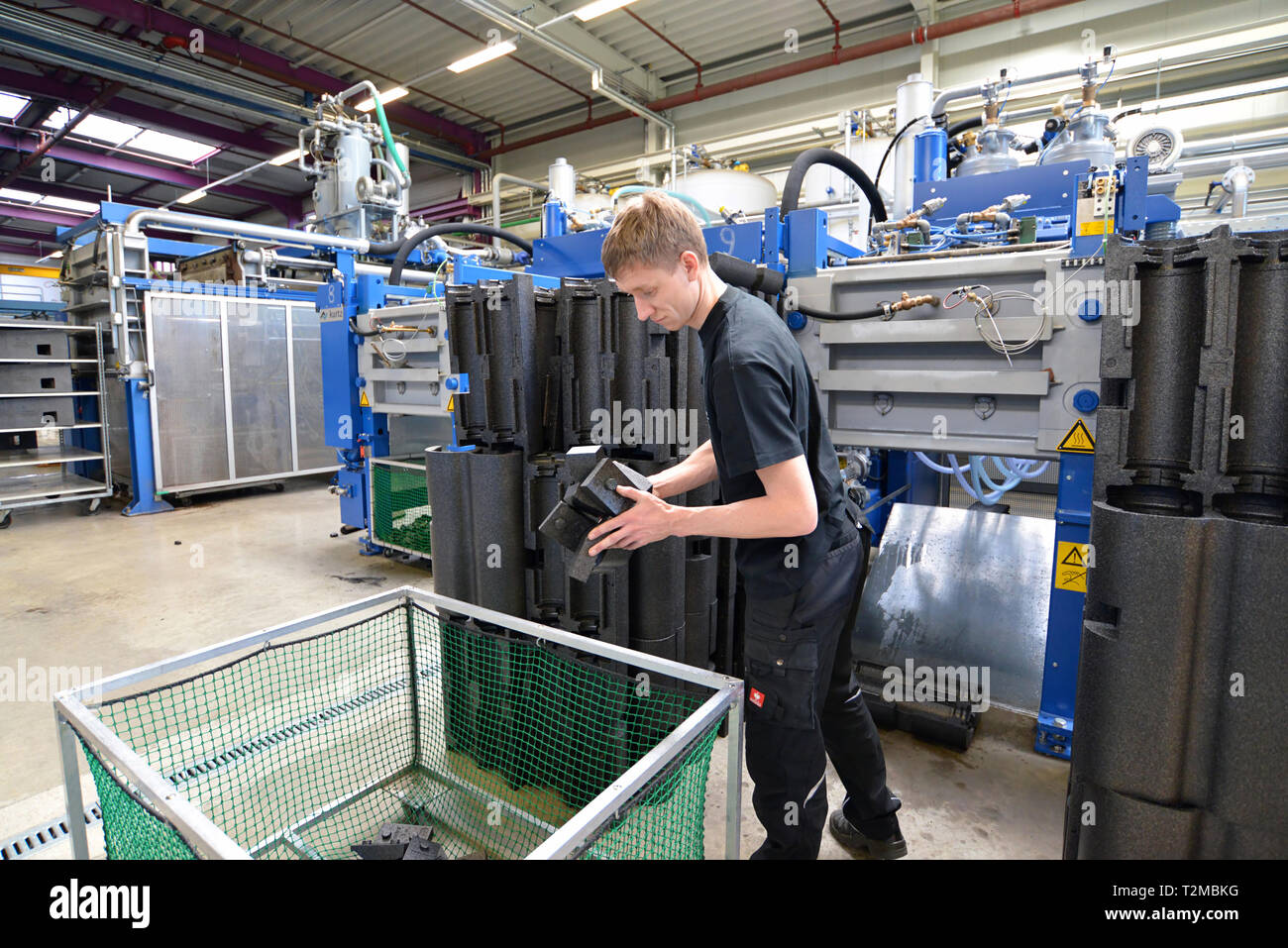 Factory worker in helmet operates hi-res stock photography and images ...