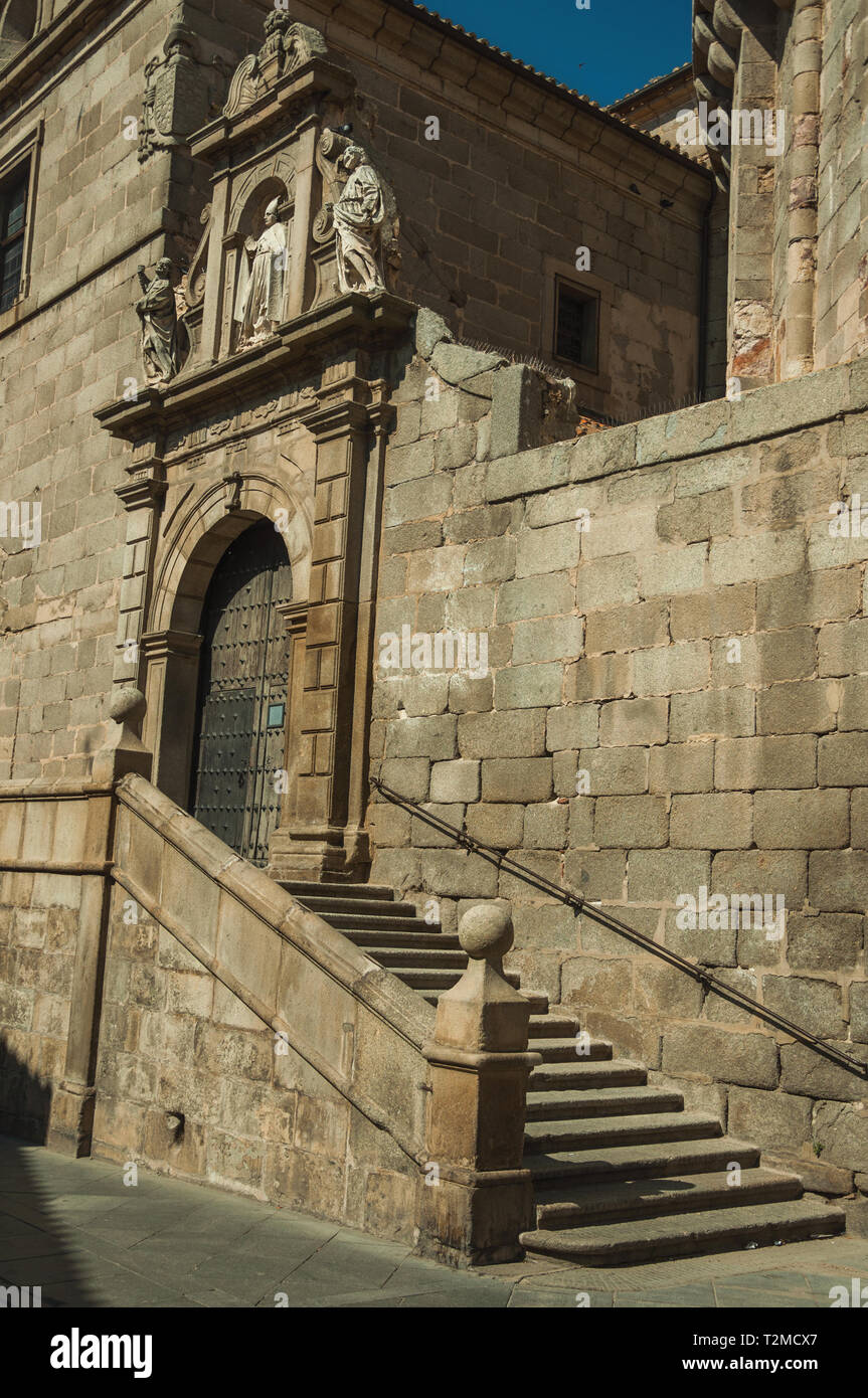 Gateway decorated with sculptures on top of staircase in a clerical ...