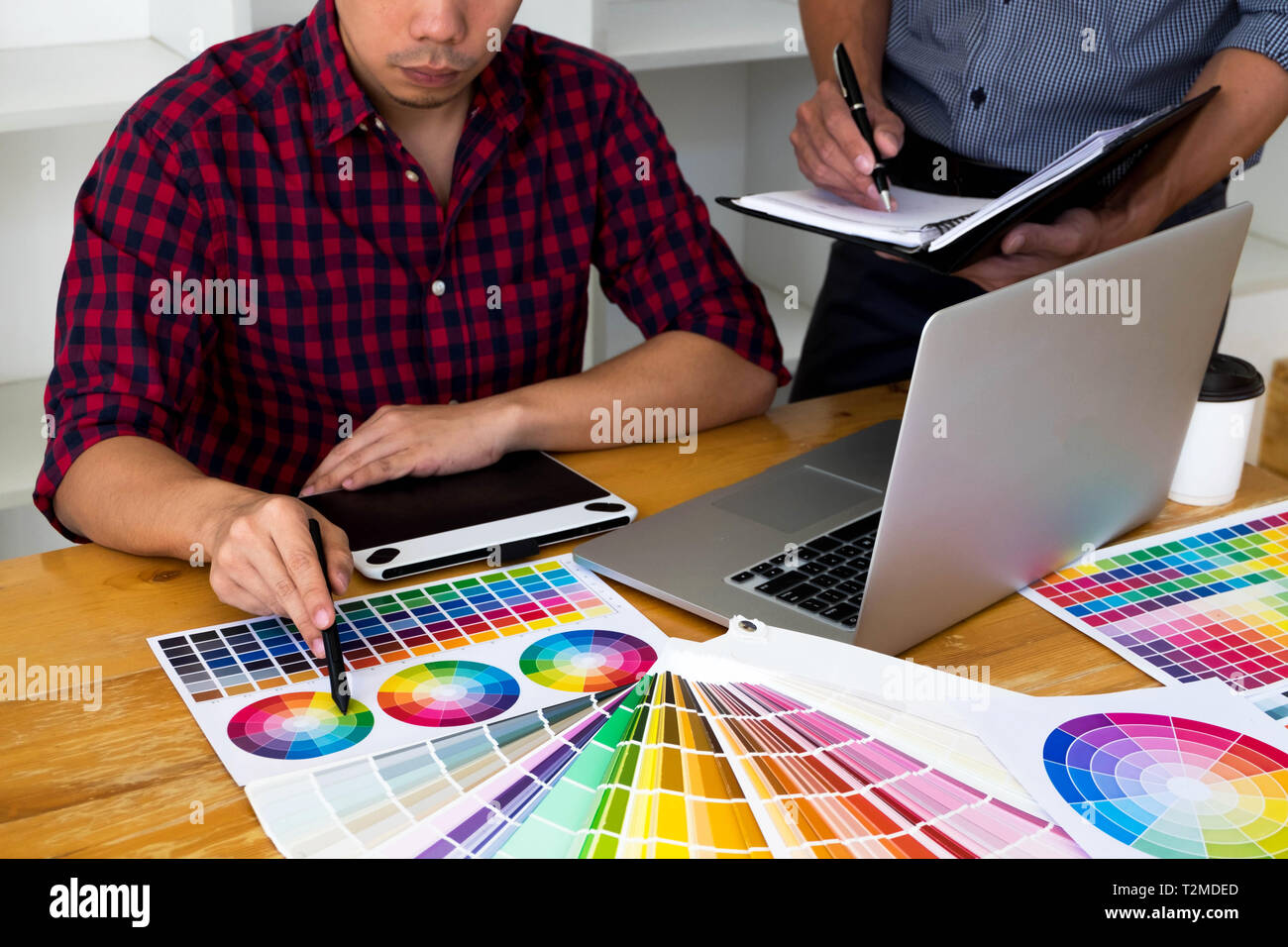 Graphic designers choose colors from the color bands samples for design ...