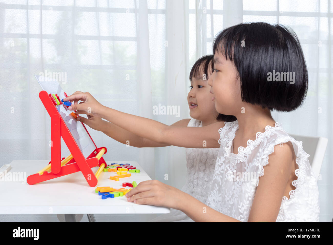 Asian Chinese little girls playing toys at home Stock Photo - Alamy