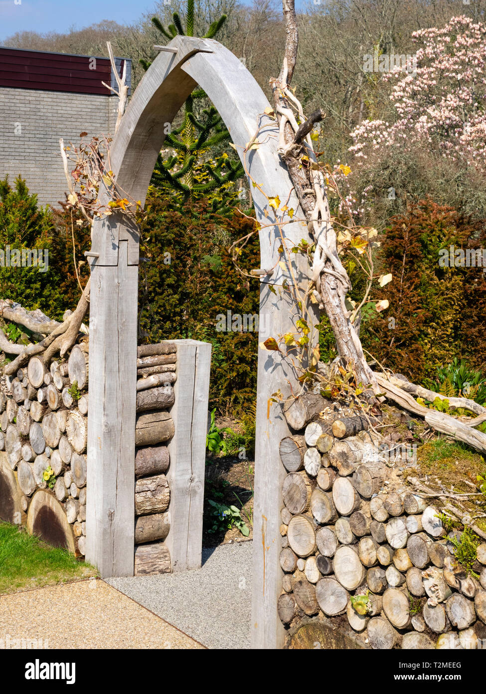 Cut log wall and green oak archway on the front of the Millenium Garden ...