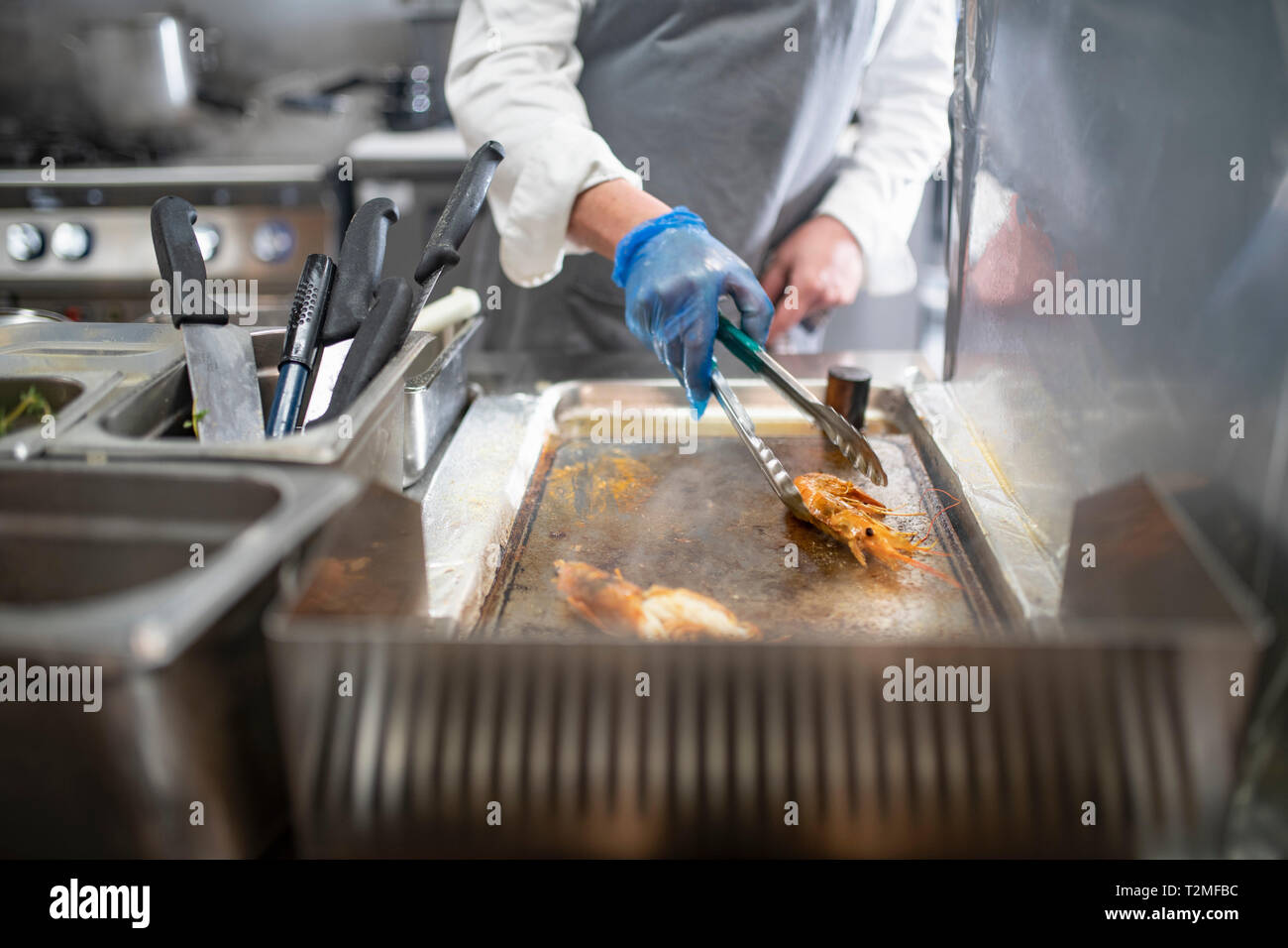 Chefs cooking seafood hi-res stock photography and images - Alamy