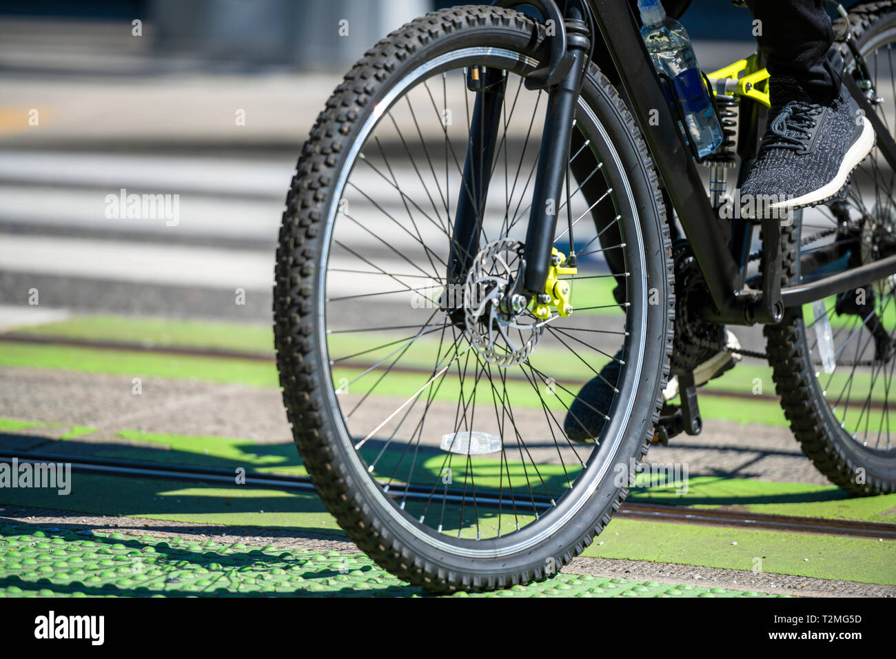Cyclist cycling pedals a bicycle and rides along a dedicated bicycle ...