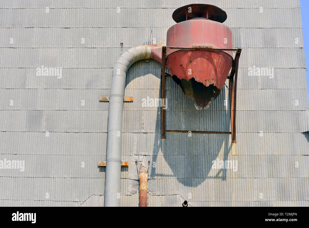 Rusty chute on a metal grain storage bin Stock Photo - Alamy
