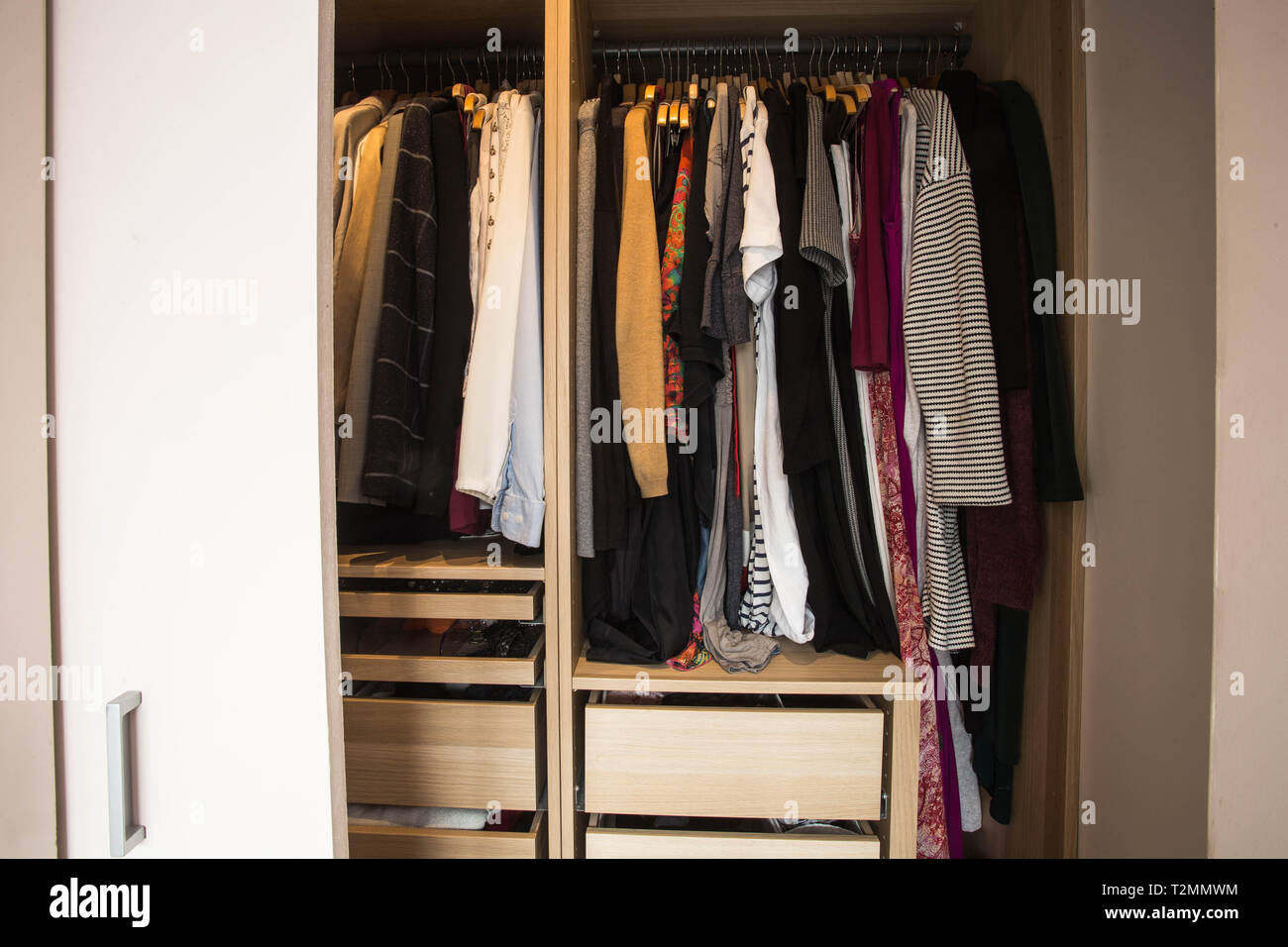 Wardrobe with messy clothes, closeup fashion design colors Stock Photo ...