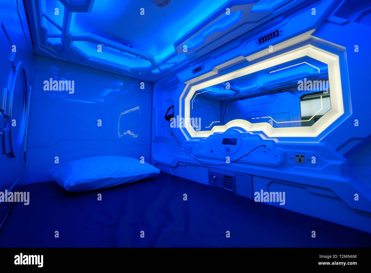 Futuristic capsule hotel room interior Stock Photo - Alamy