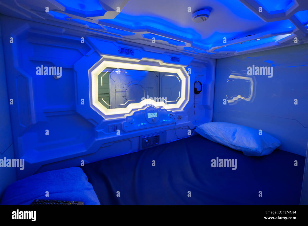 Futuristic capsule hotel room interior Stock Photo - Alamy