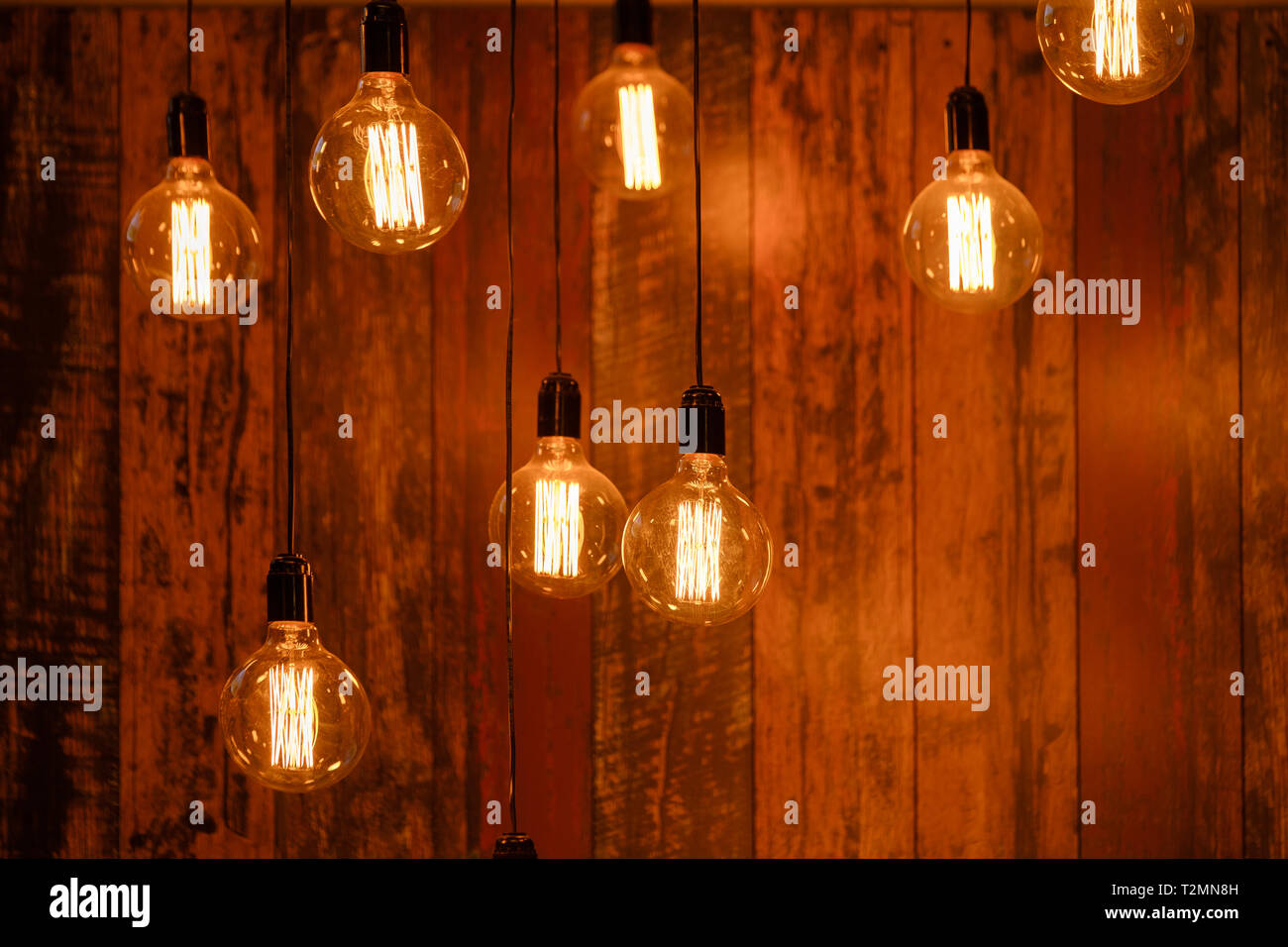 Edison bulbs in cafe interior design background Stock Photo - Alamy