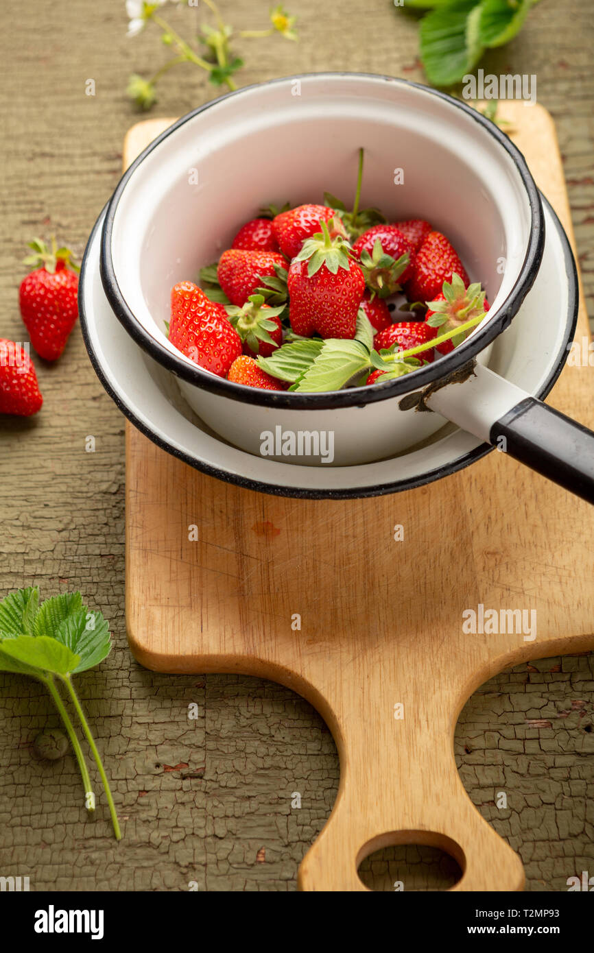 Fresh strawberry in vintage colander Stock Photo - Alamy