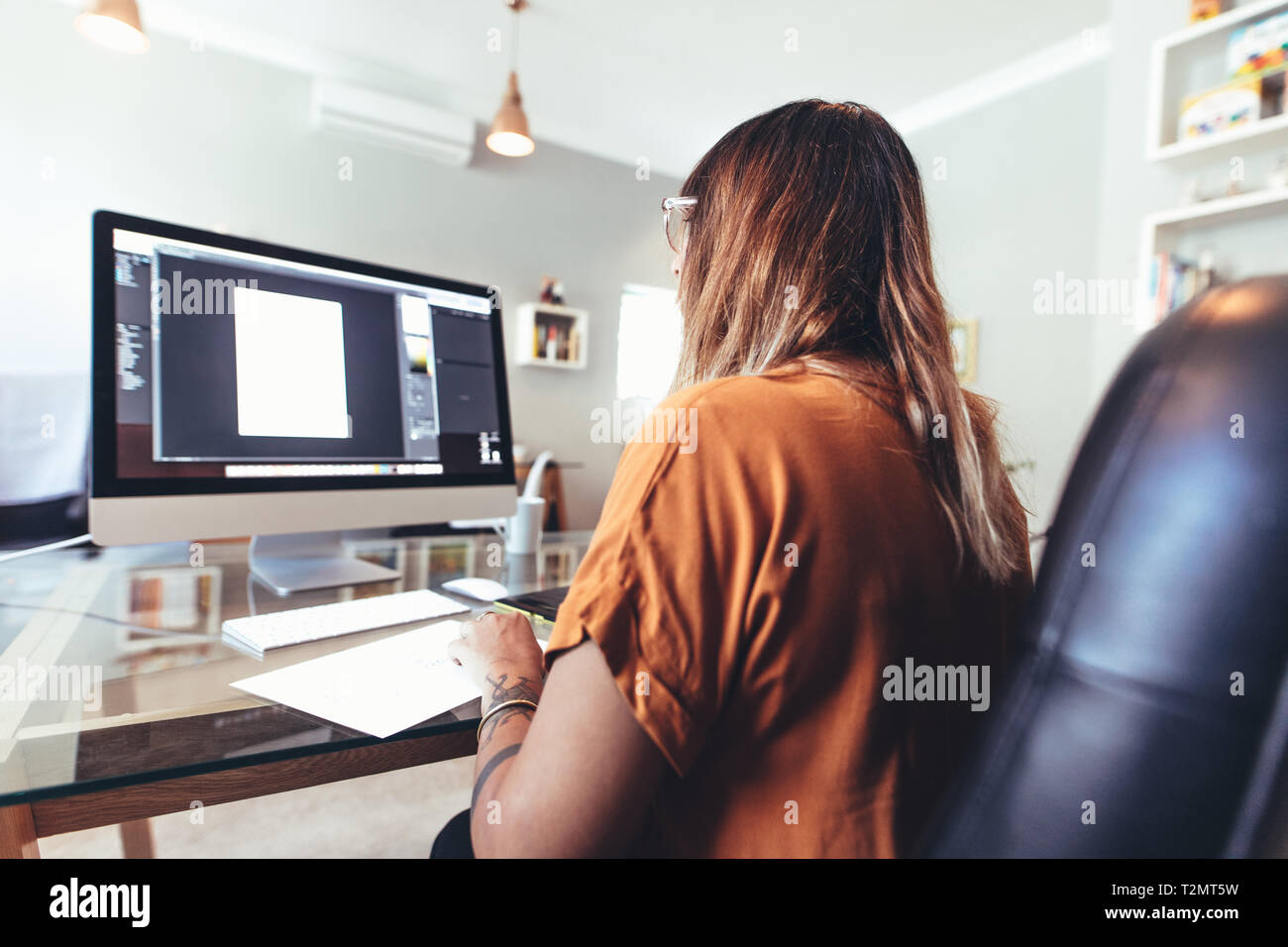 Woman work computer rear view hi-res stock photography and images - Alamy