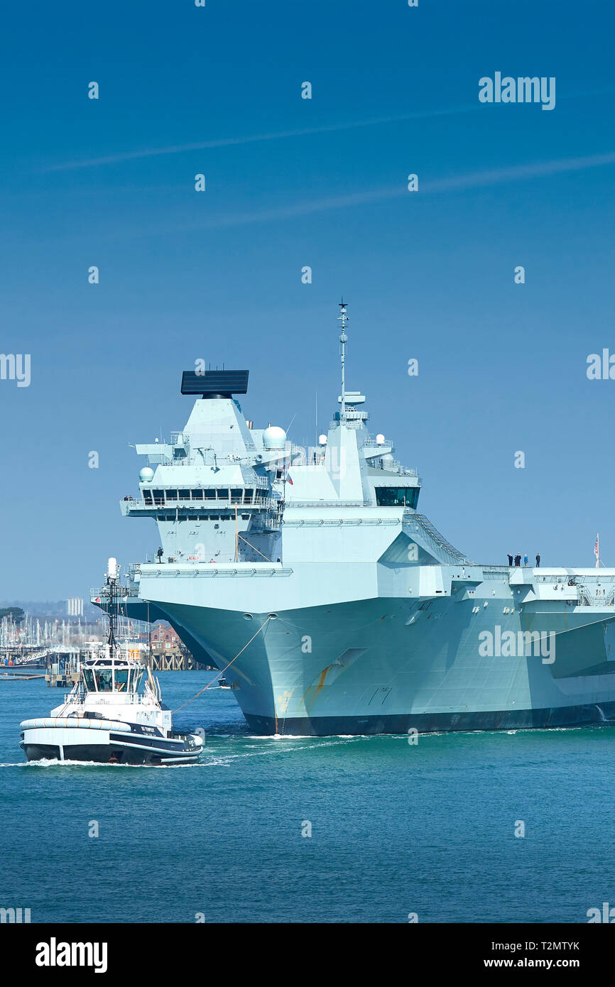 Royal Navy Aircraft Carrier, HMS QUEEN ELIZABETH, Being Assisted By Tug ...