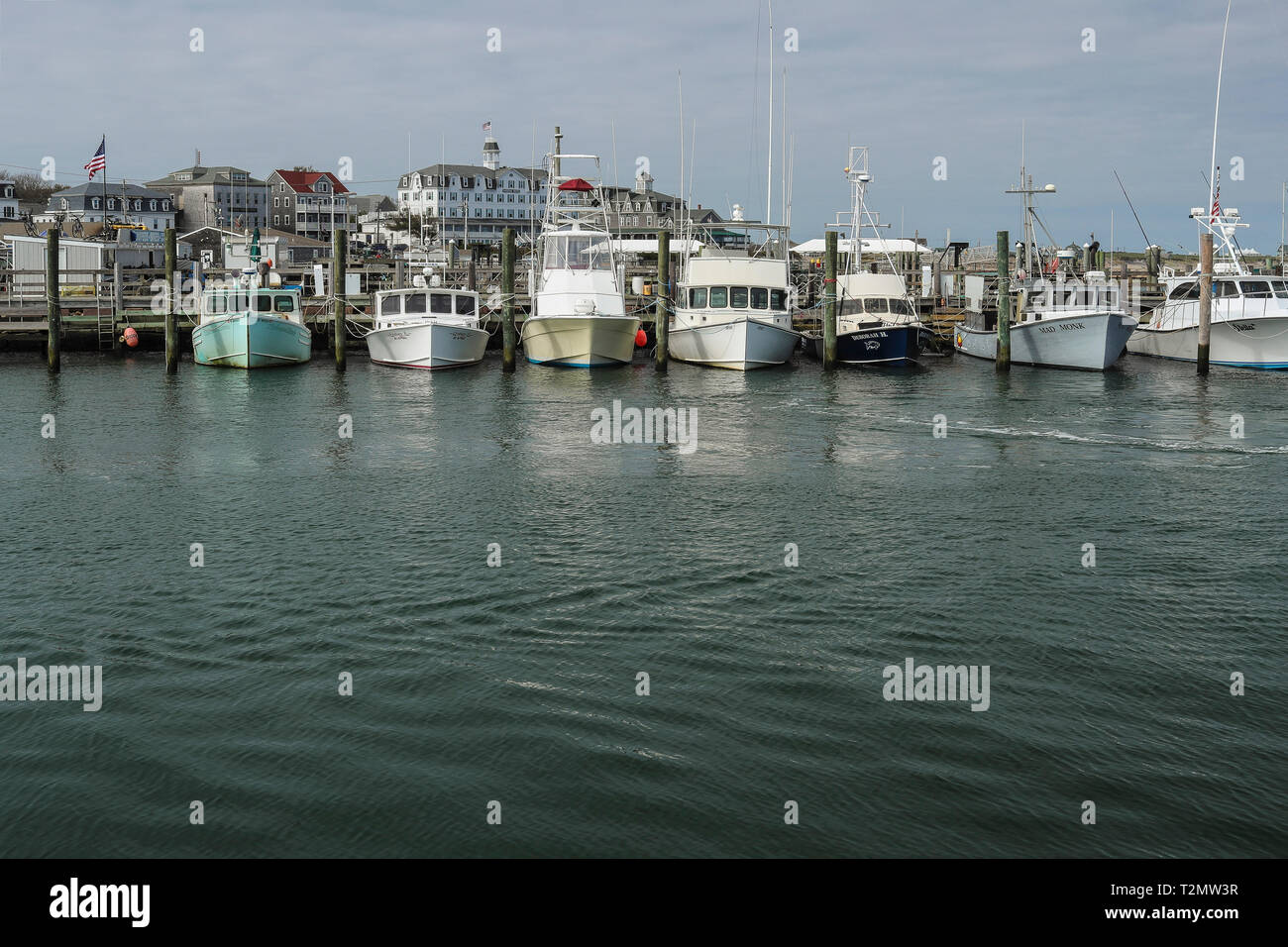 Boats at mooring, hotels in background. Block Island Rhode Island, USA ...