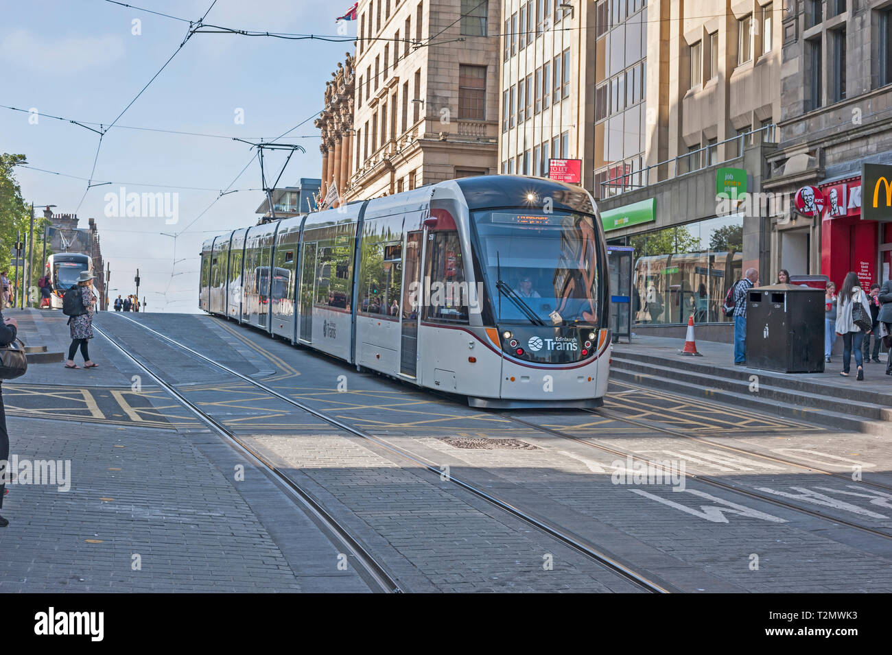 Edinburgh electric tram descending hill in city centre, Scotland, UK ...