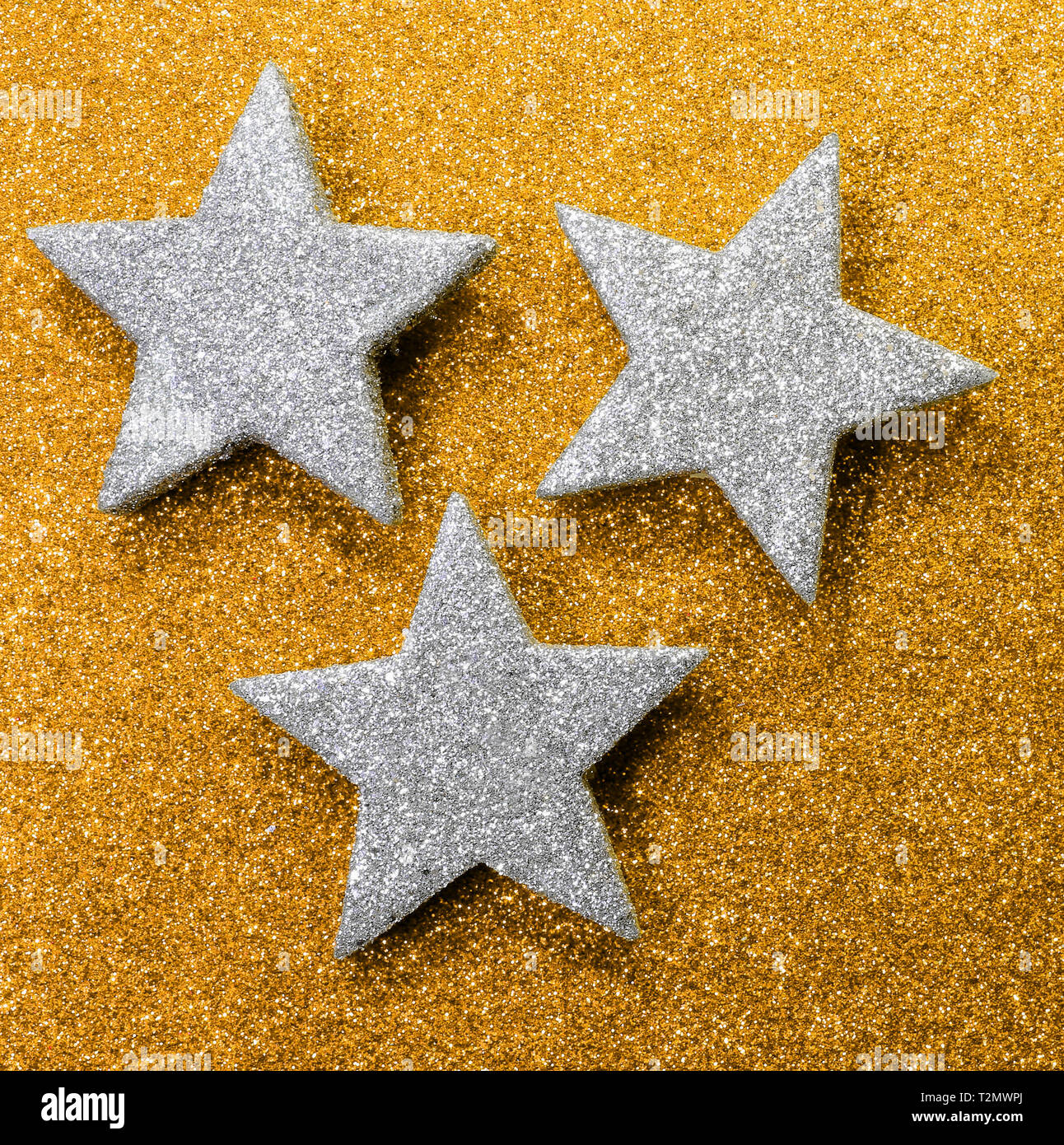 large silver stars on bright yellow golden glittery background Stock ...