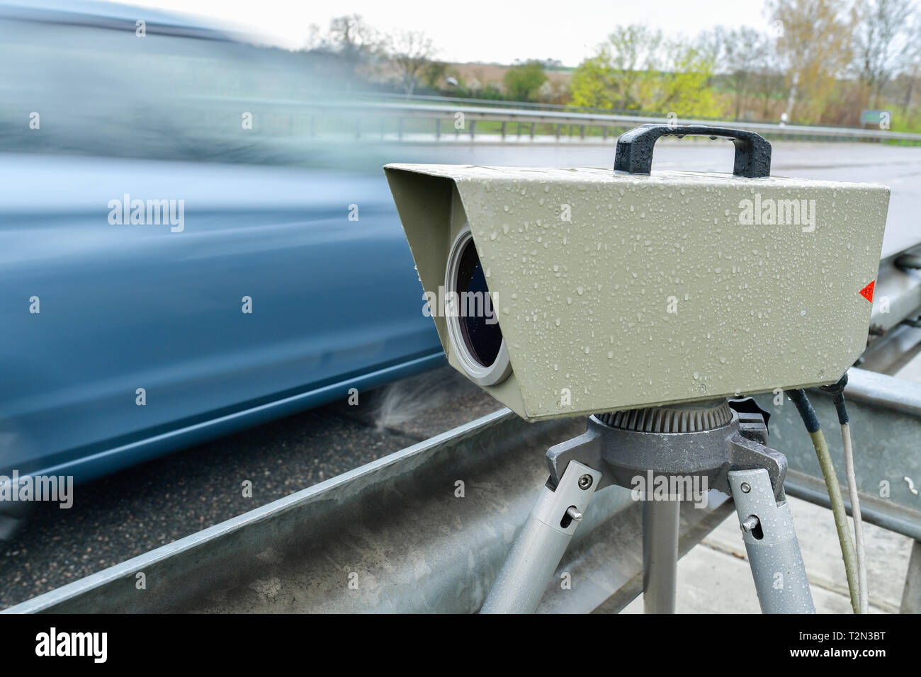 Sinsheim, Germany. 03rd Apr, 2019. A blue car drives past a measuring ...