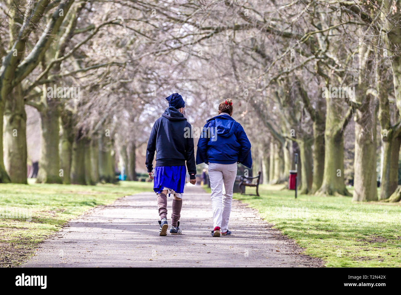 Two people walking through pathway hi-res stock photography and images ...