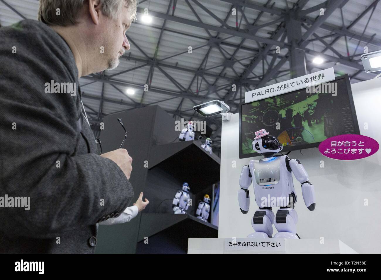 Tokyo, Japan. 3rd Apr, 2019. A display shows a man's face through robot ...