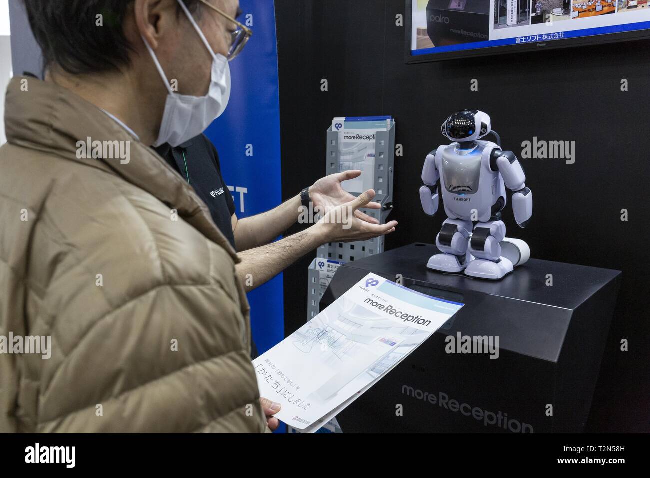 Tokyo, Japan. 3rd Apr, 2019. A visitor looks at a robot PALRO during ...