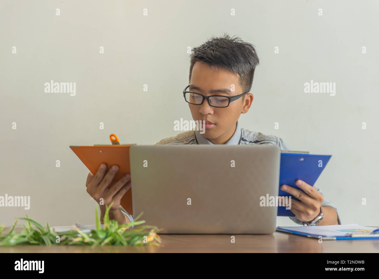 Office man checking financial hi-res stock photography and images - Alamy