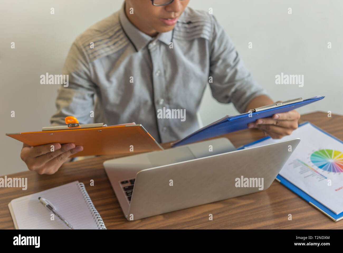 Checking financial reports paperwork hi-res stock photography and ...