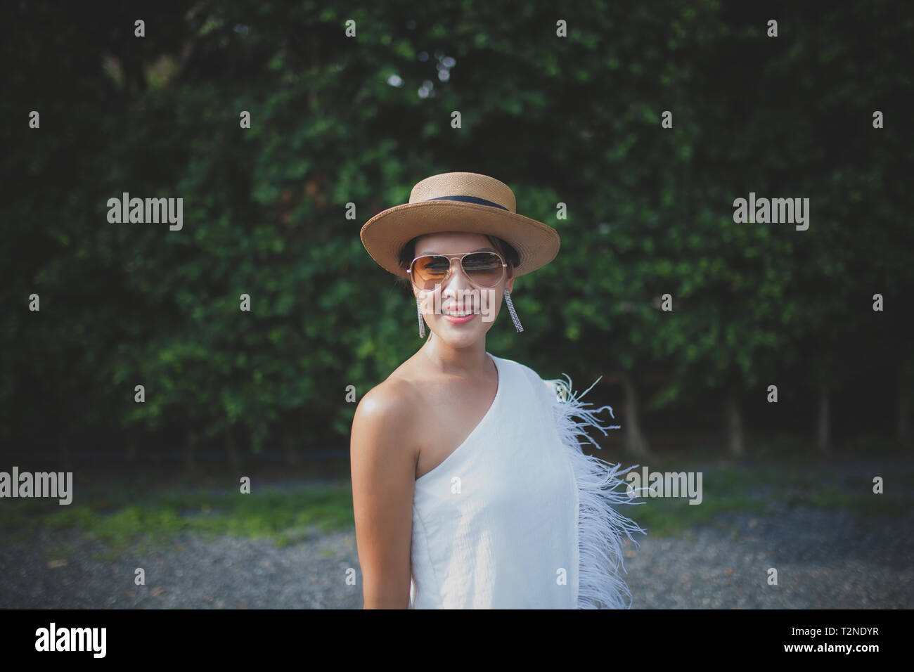 beautiful asian woman wearing white dress with straw hat toothy smiling ... beautiful asian woman wearing white dress with straw hat toothy smiling ...