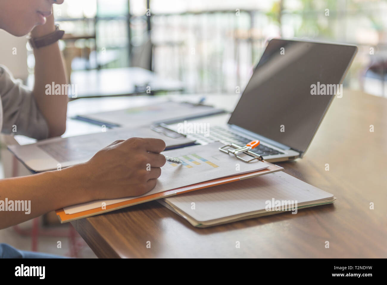Office man reading financial document at the workplace Stock Photo - Alamy
