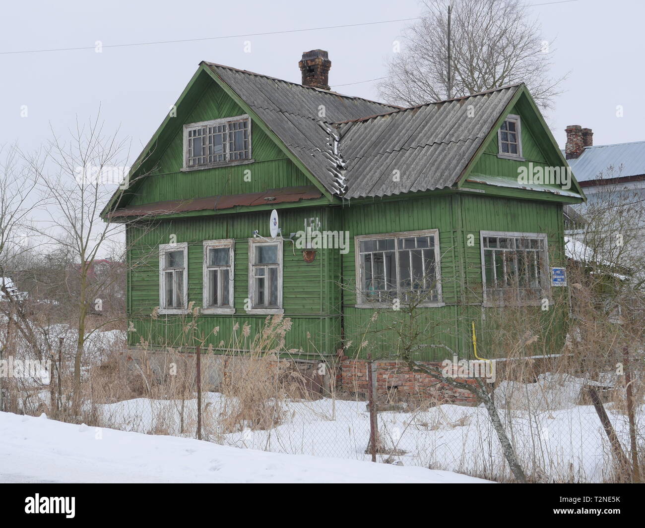 Russia, Leningrad region March 12, 2016, aged wooden house of the ...