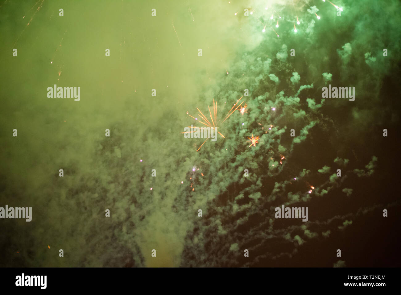 Explosive and colorful holiday fireworks at night sky. Celebration City ...