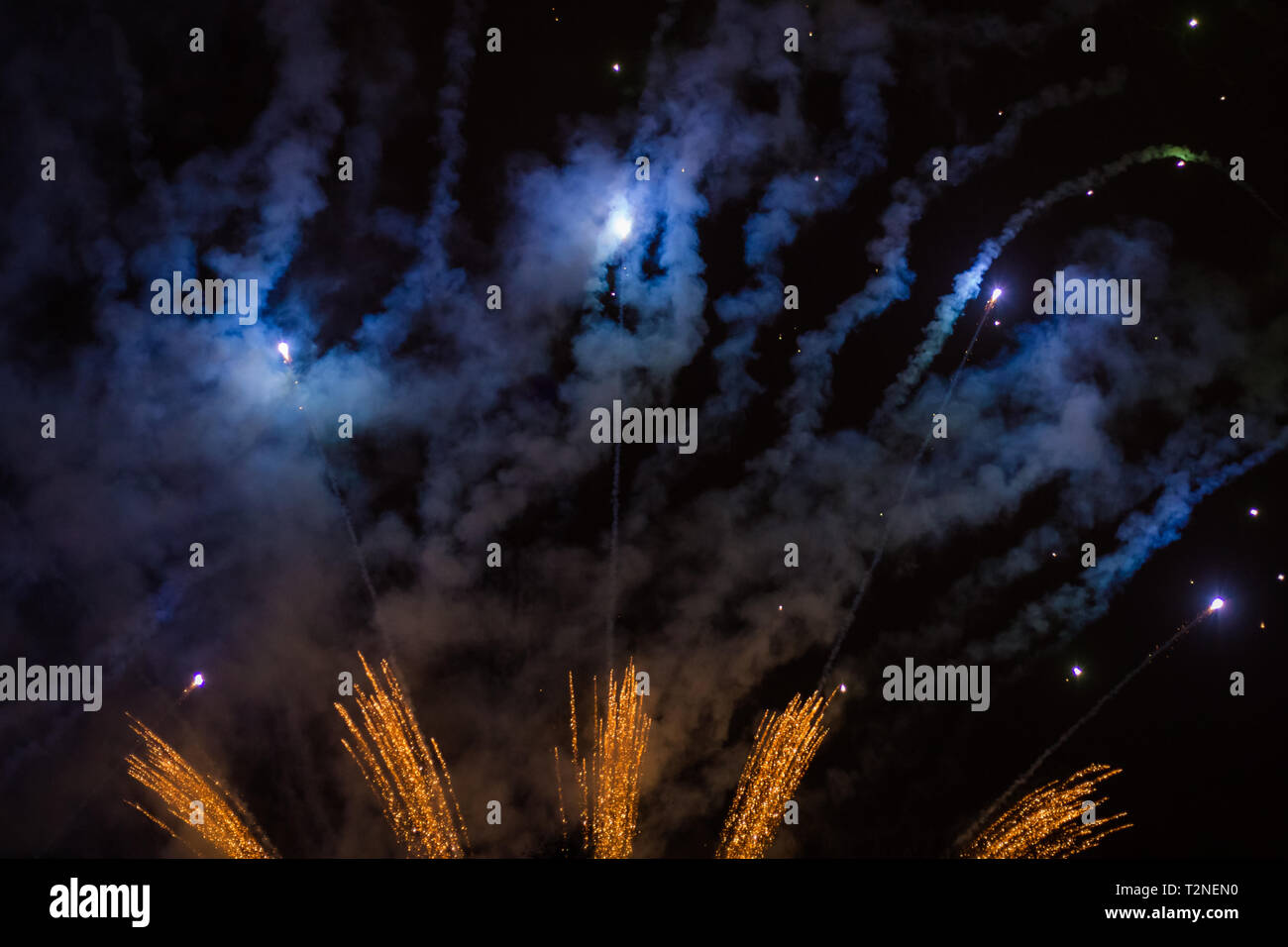 Explosive and colorful holiday fireworks at night sky. Celebration City ...