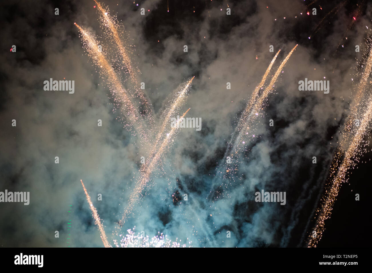 Explosive and colorful holiday fireworks at night sky. Celebration City ...