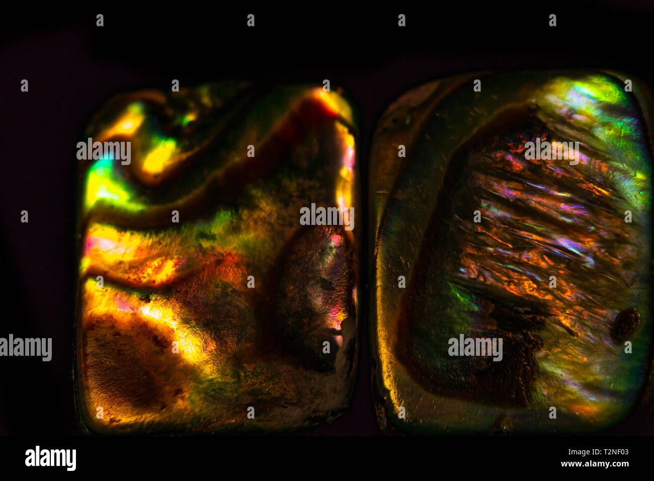 abstract gemstone background, colorful nacre shimmering on black ...