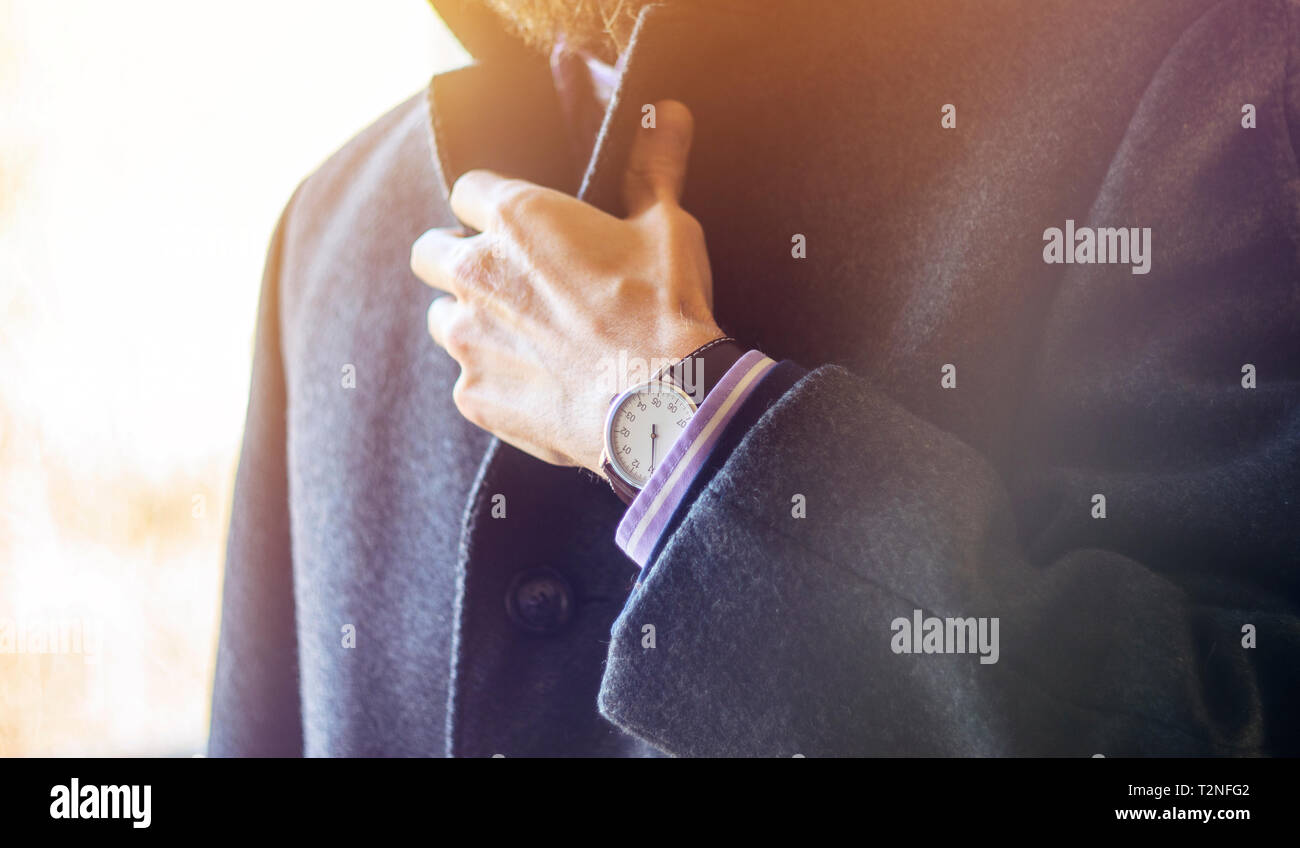 Businessman adjusting watch hi-res stock photography and images - Alamy