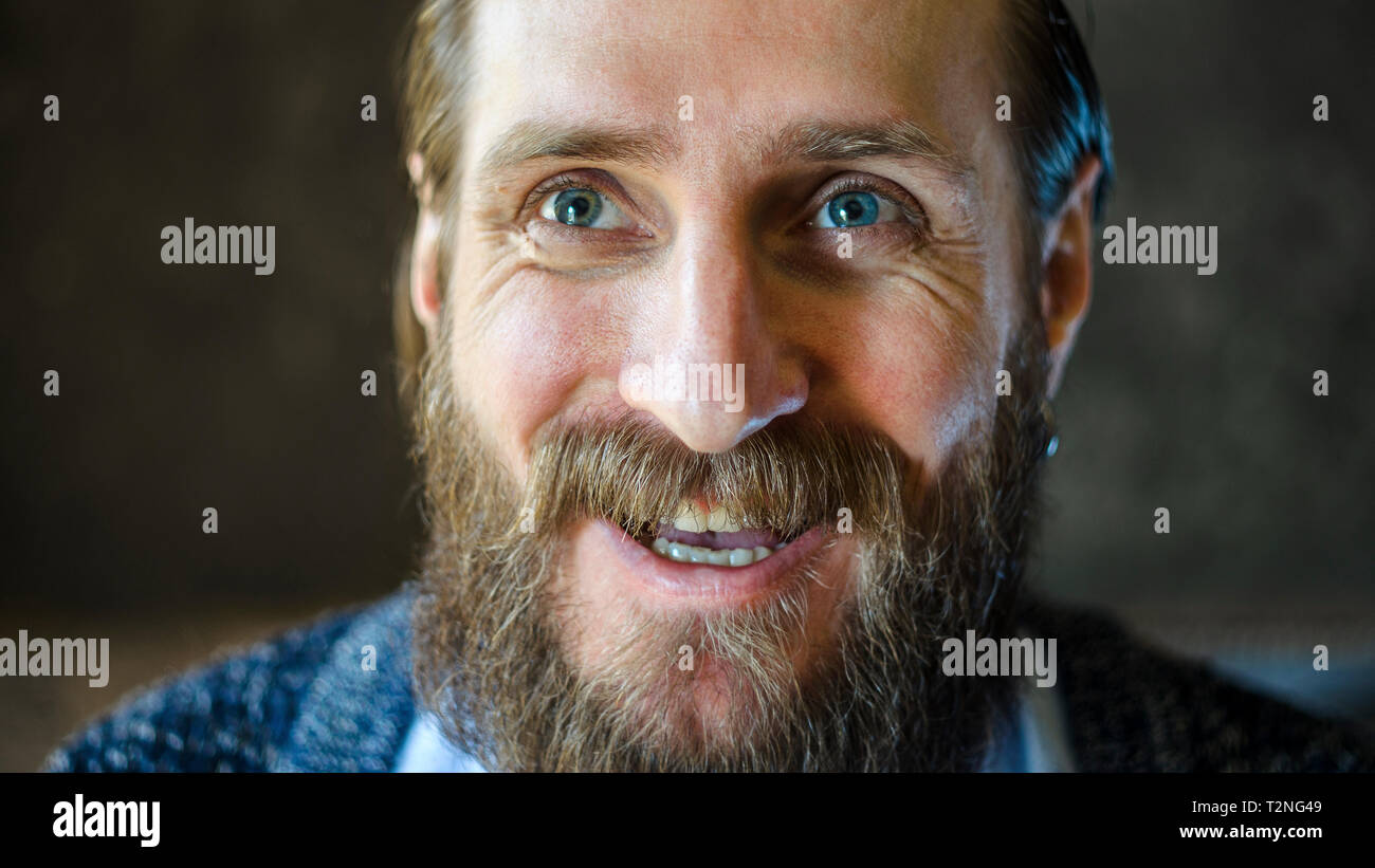 Casual portrait of a young man laughing isolated over a white ...