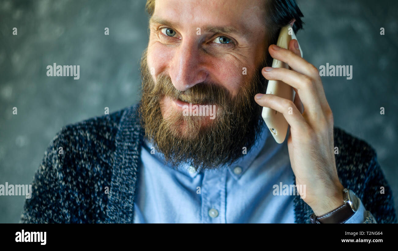 Happy Bearded Man Talk at Phone. Open and Friendly Communication with a ...