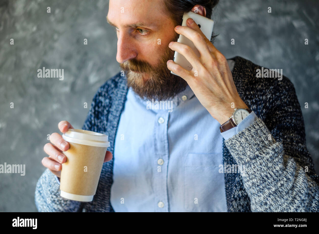 Bearded Man Talking on a Mobile Phone with Indifference. Difficult ...