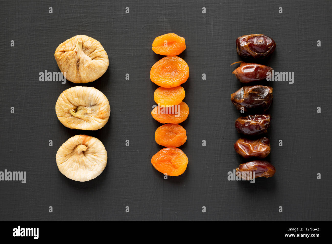 Dried fruits on black background, top view. Overhead, from above, flat ...