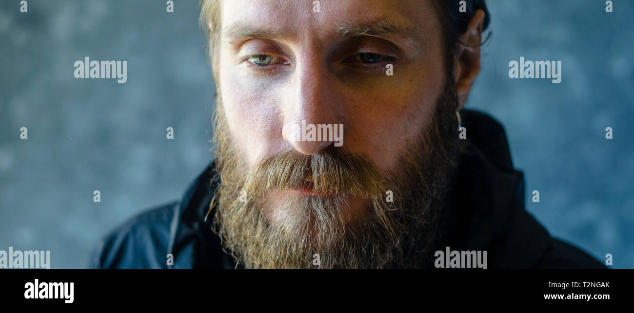 Portrait of a Serious Sad Man with a Beard. Cinematic Crop. Thinkness ...