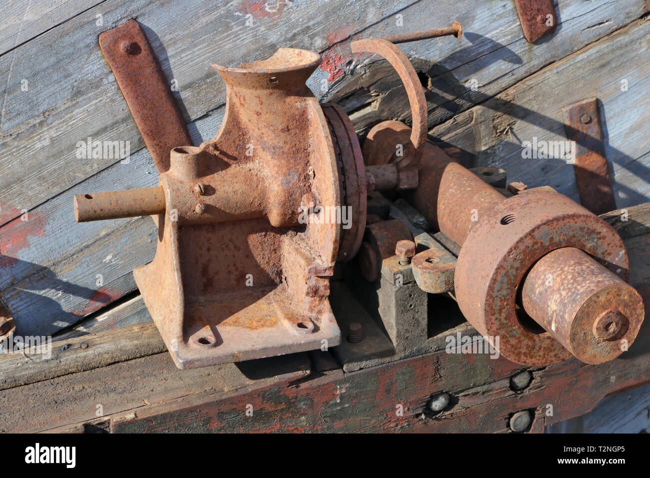 Rusty vintage small agricultural machine parts. The metal equipment is ...