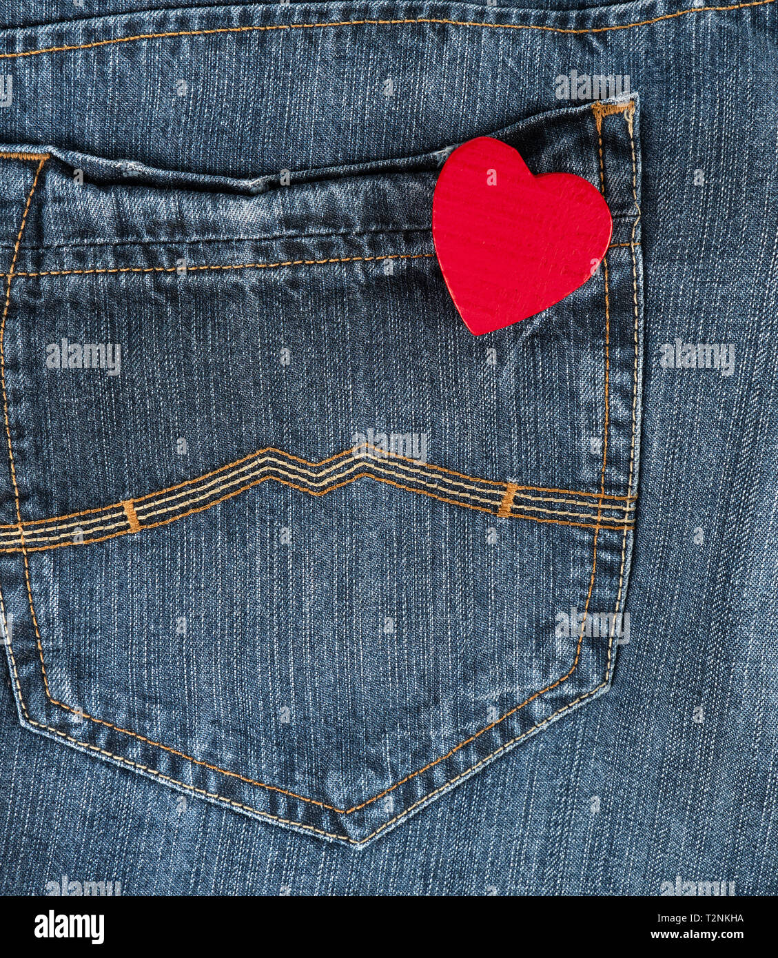 small red heart in the back pocket of blue jeans, full frame Stock ...
