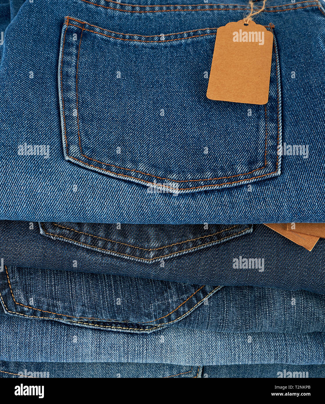 Stack folded jeans tag hi-res stock photography and images - Alamy
