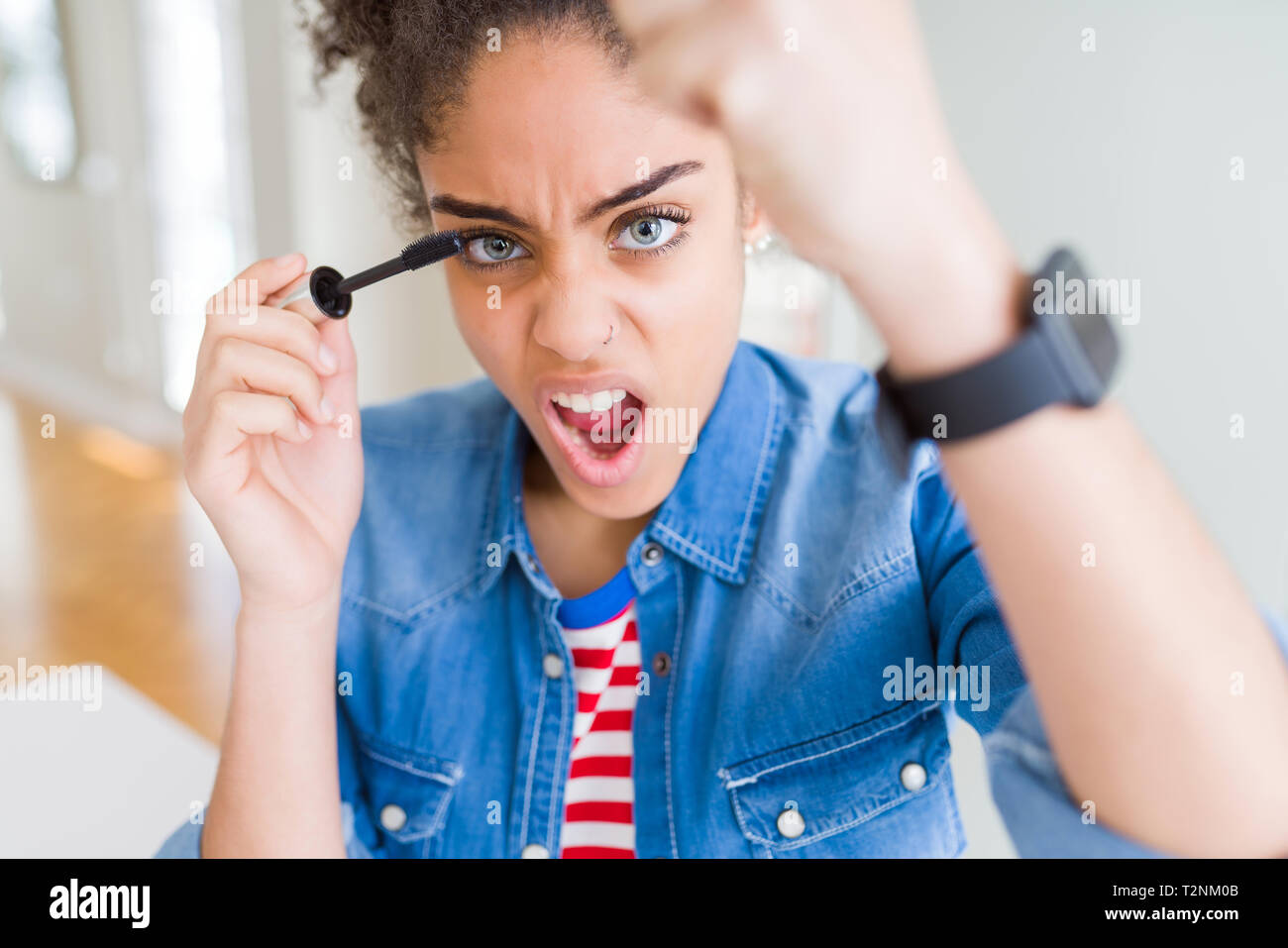 Applying makeup angry hi-res stock photography and images - Alamy