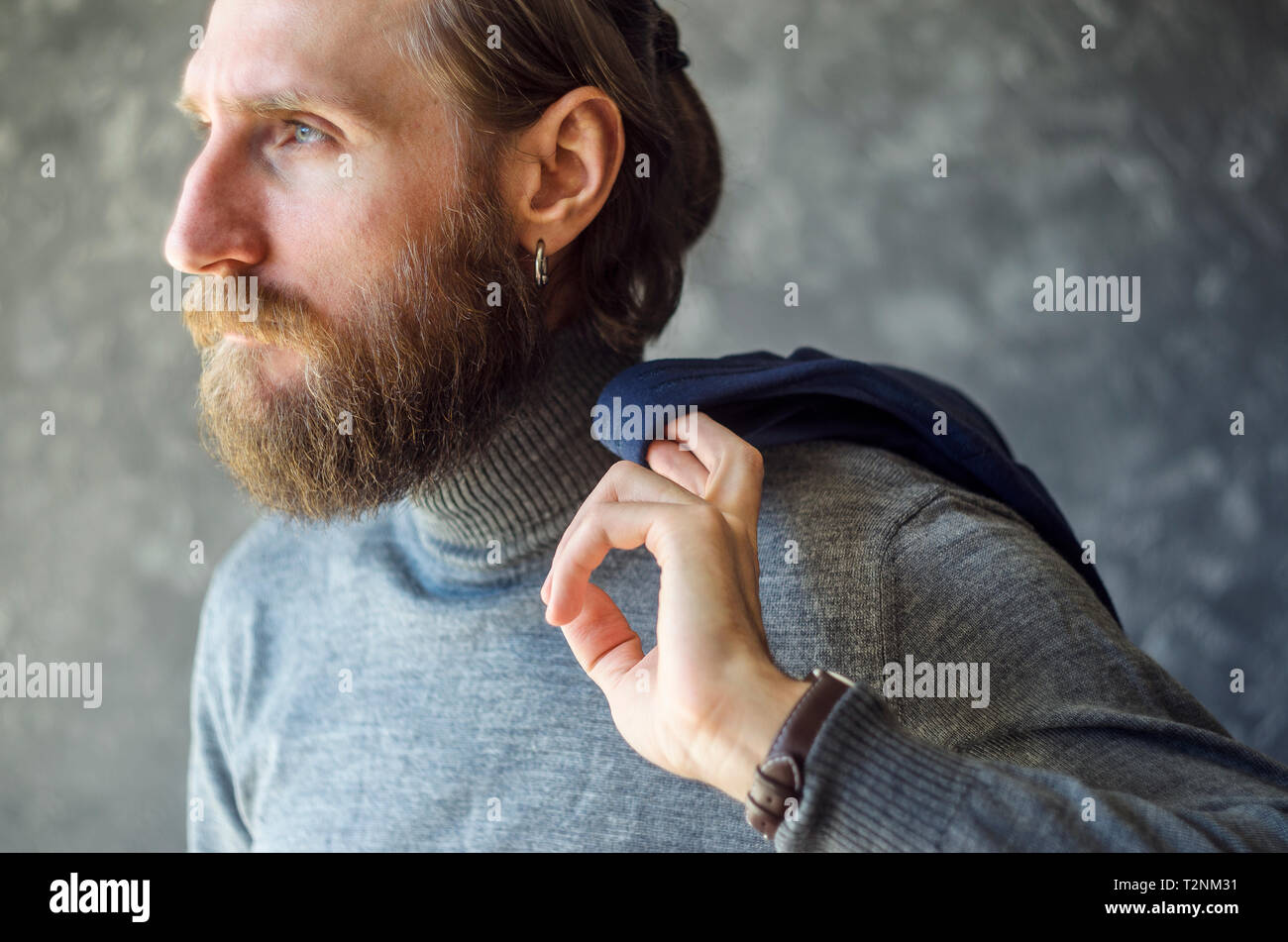 Fashion Portrait of Bearded Man in Gray High Neck Sweater with a Blue ...