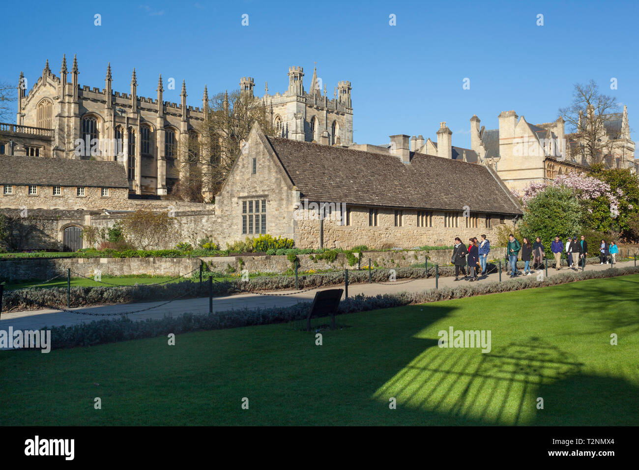 Tourists walk along the Broad Walk with Christ Church Cathedral behind ...